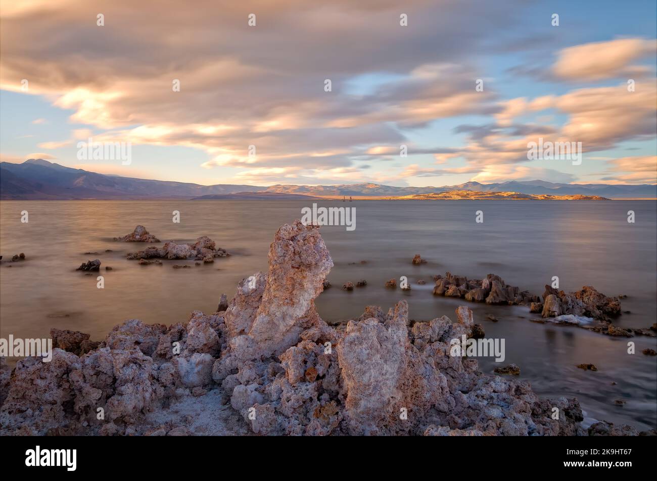 A serene beauty of Mono Lake, California, at sunset featuring a cluster ...