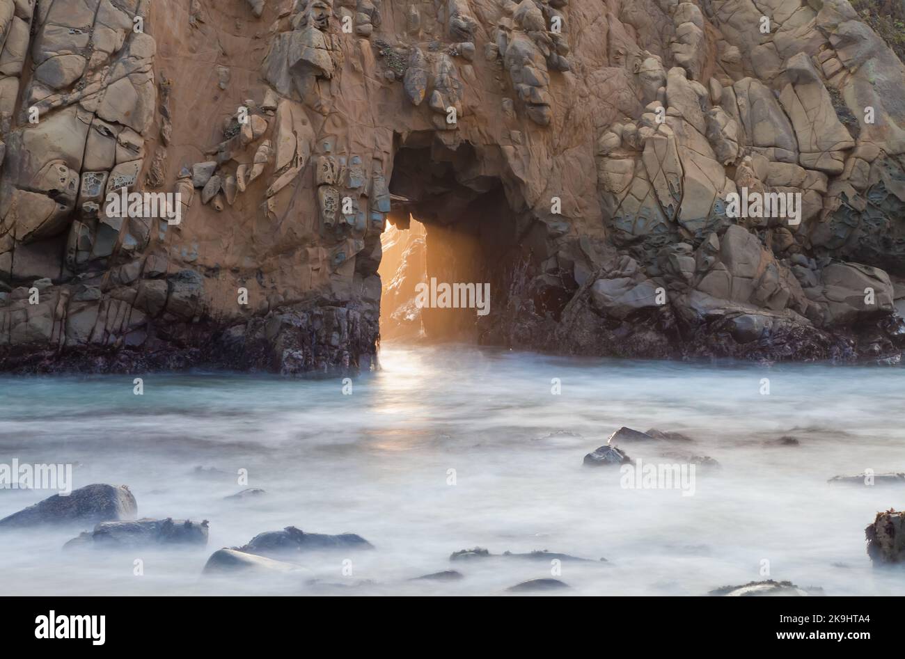 A stunning photograph captures the golden glow of a setting sun as it ...