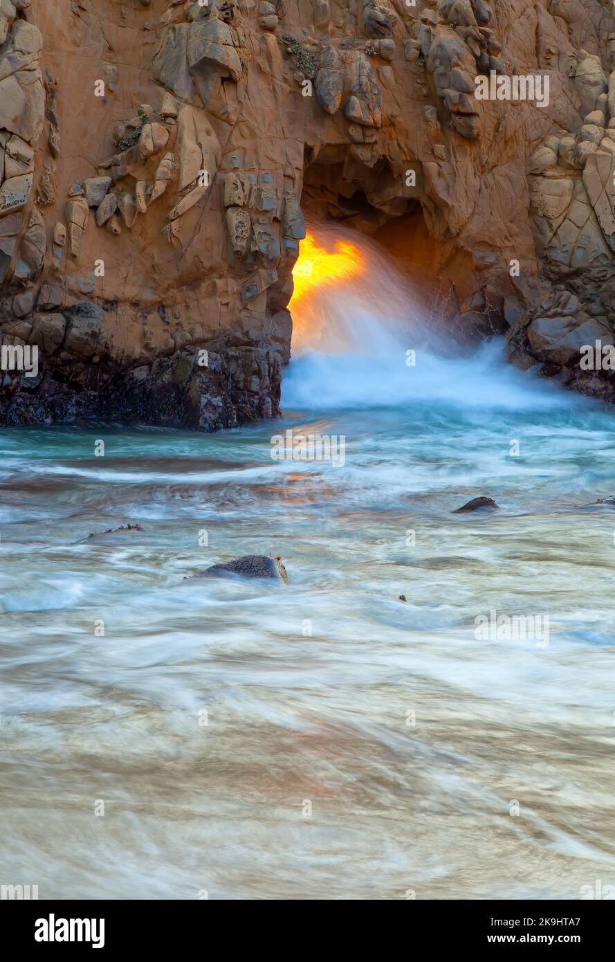 A stunning photograph captures the golden glow of a setting sun as it ...