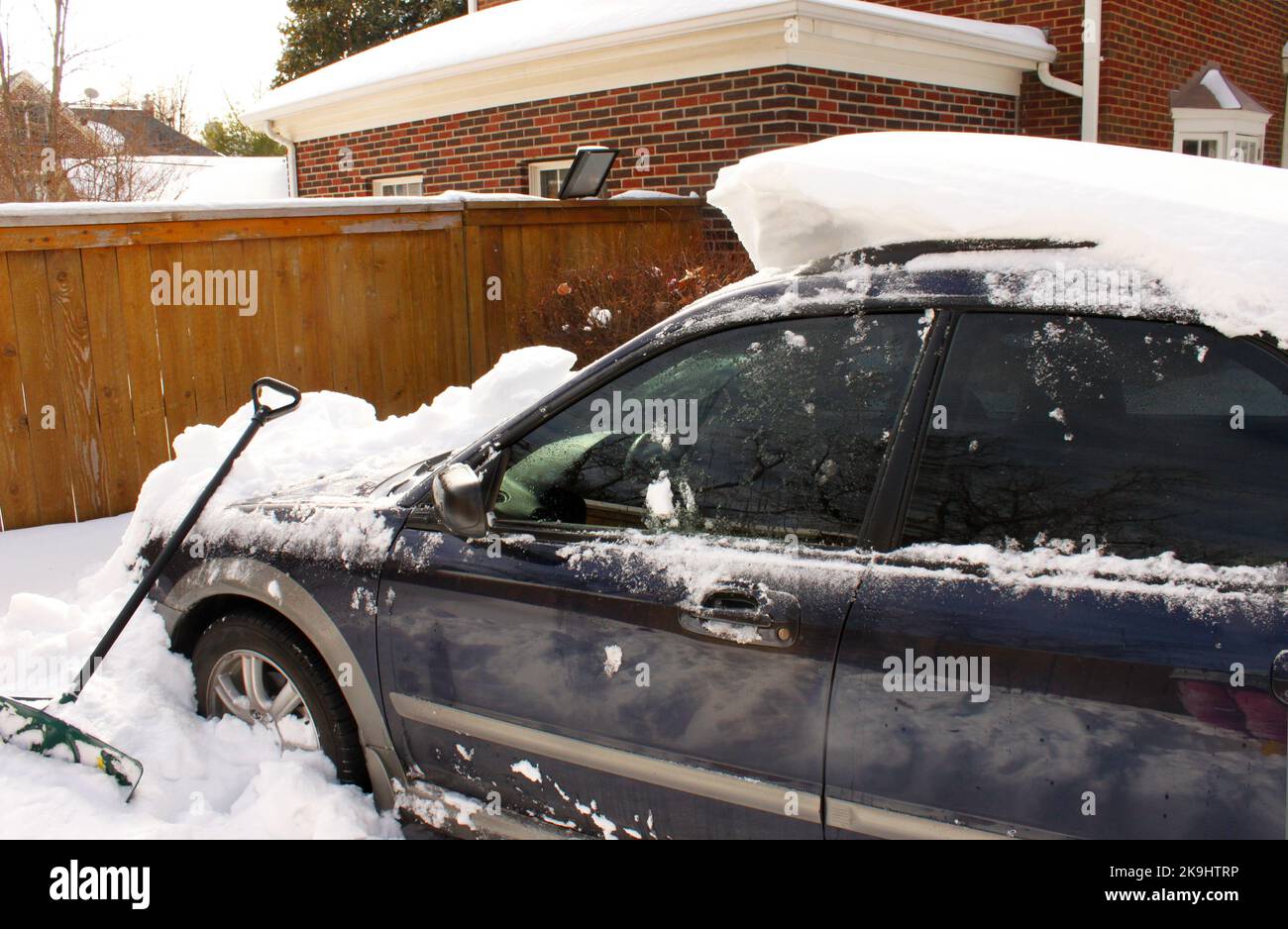 Shoveling Deep Snow In Driveway of House With Car Half Buried Stock ...