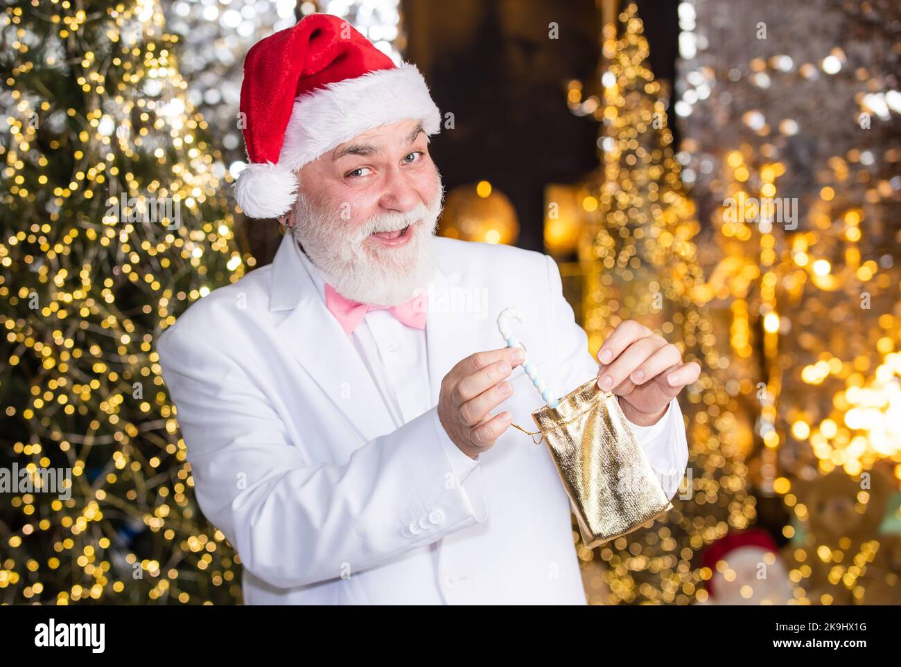 Great present. man put candy stick in little gold sack. small and ...