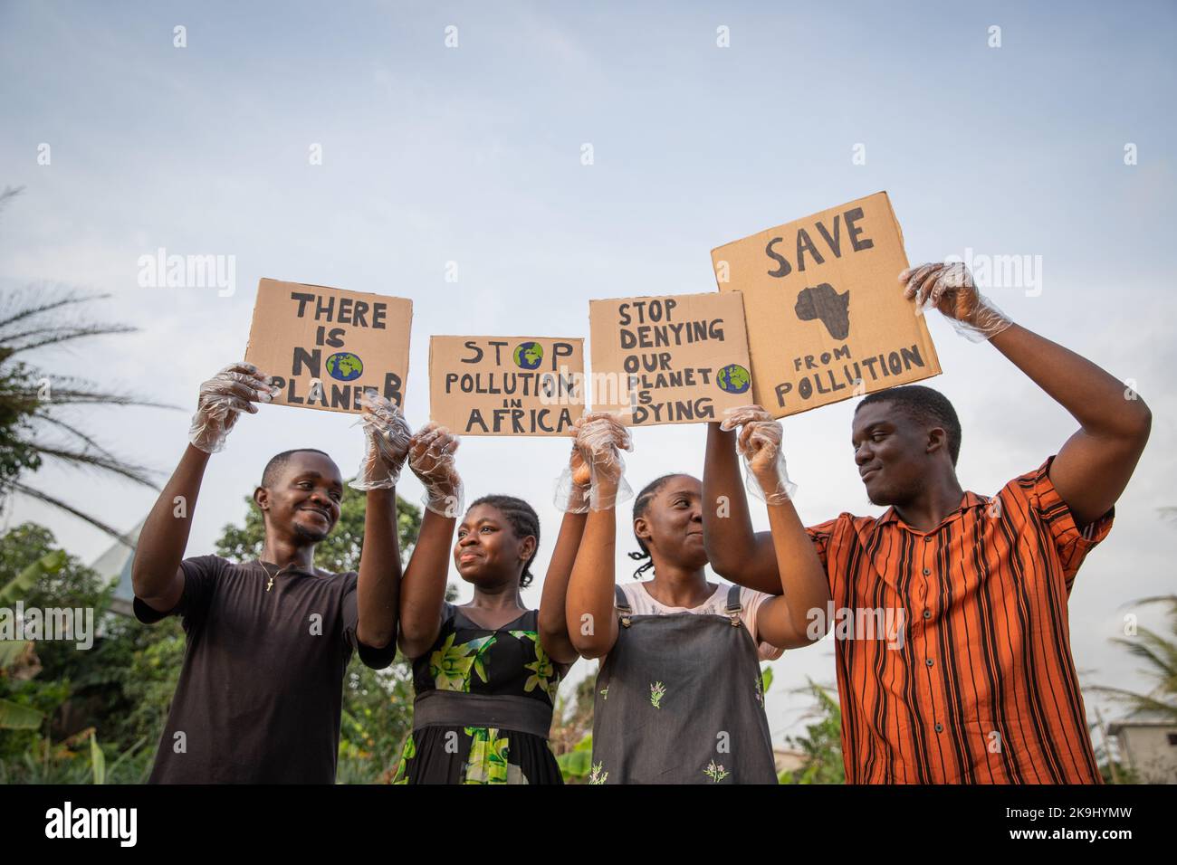 Youth holding signs with written: there is no planet b, stop pollution ...