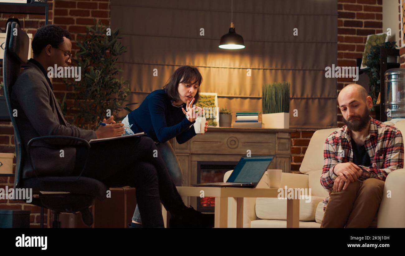 Displeased wife complaining about marriage problems at psychotherapy ...