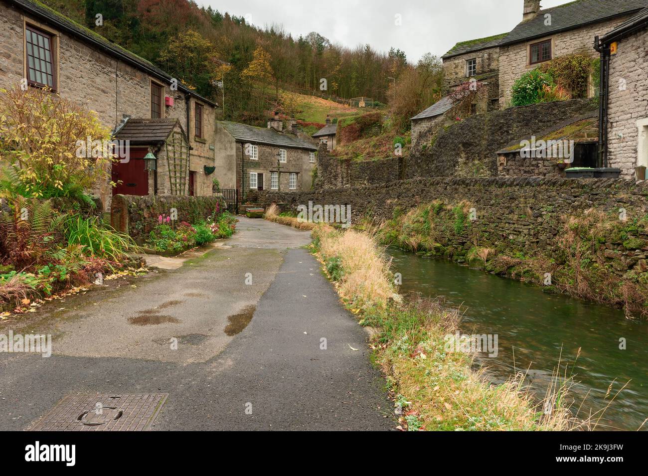Cottages and stream in the beautiful village of Castleton in the High ...