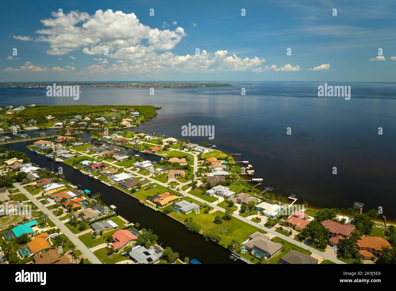 Aerial view of rural private houses in remote suburbs located on sea ...