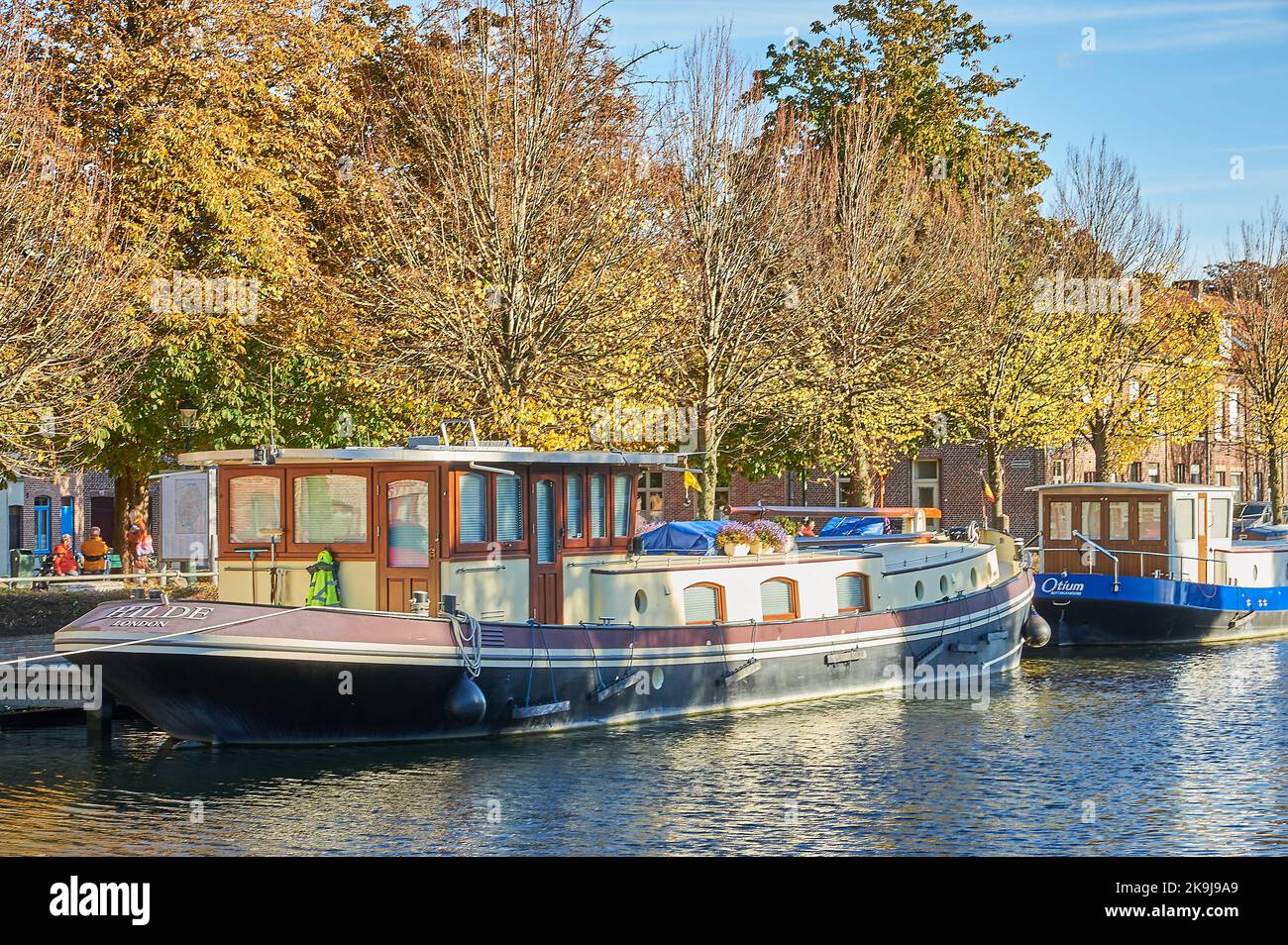 Barges moored to the banks of the Coupure canal on the edge of Bruges ...