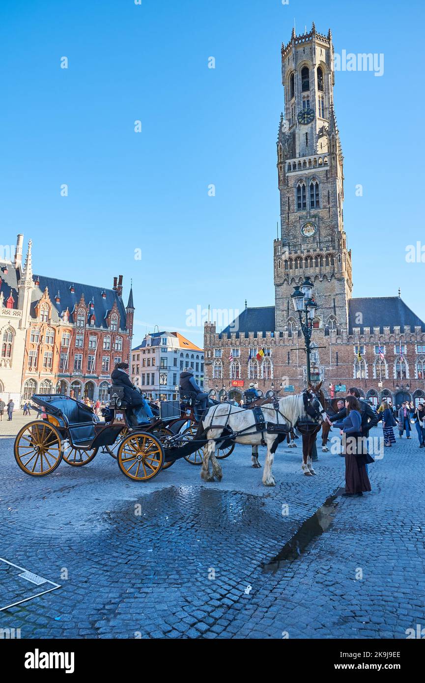 Pony and traps wait in The Markt (Market Square) in Bruges with the ...