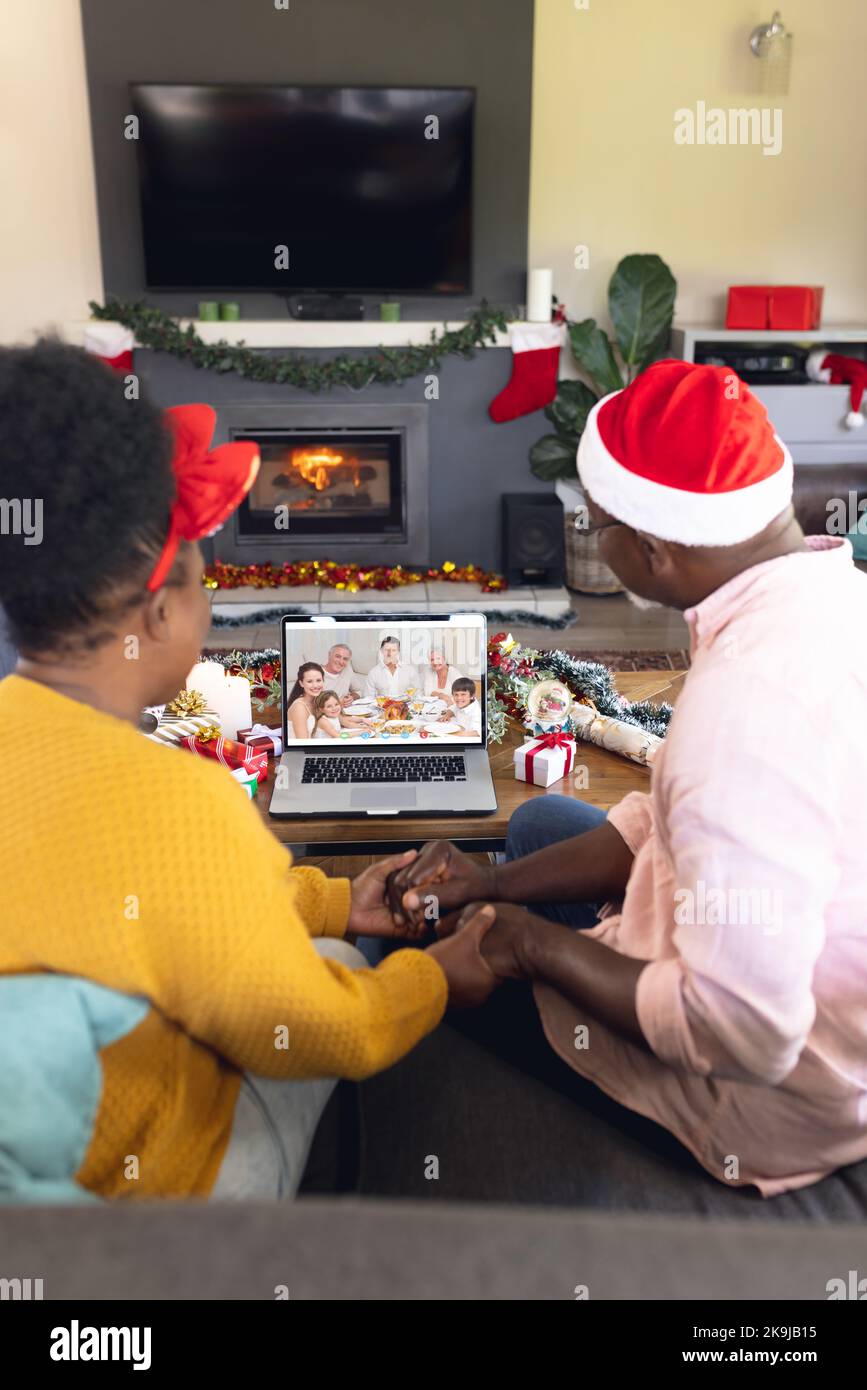 Senior african american couple having christmas video call with ...