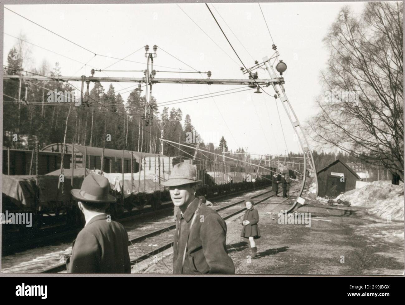 Travelers with children at yard after derailment with wagons and ...