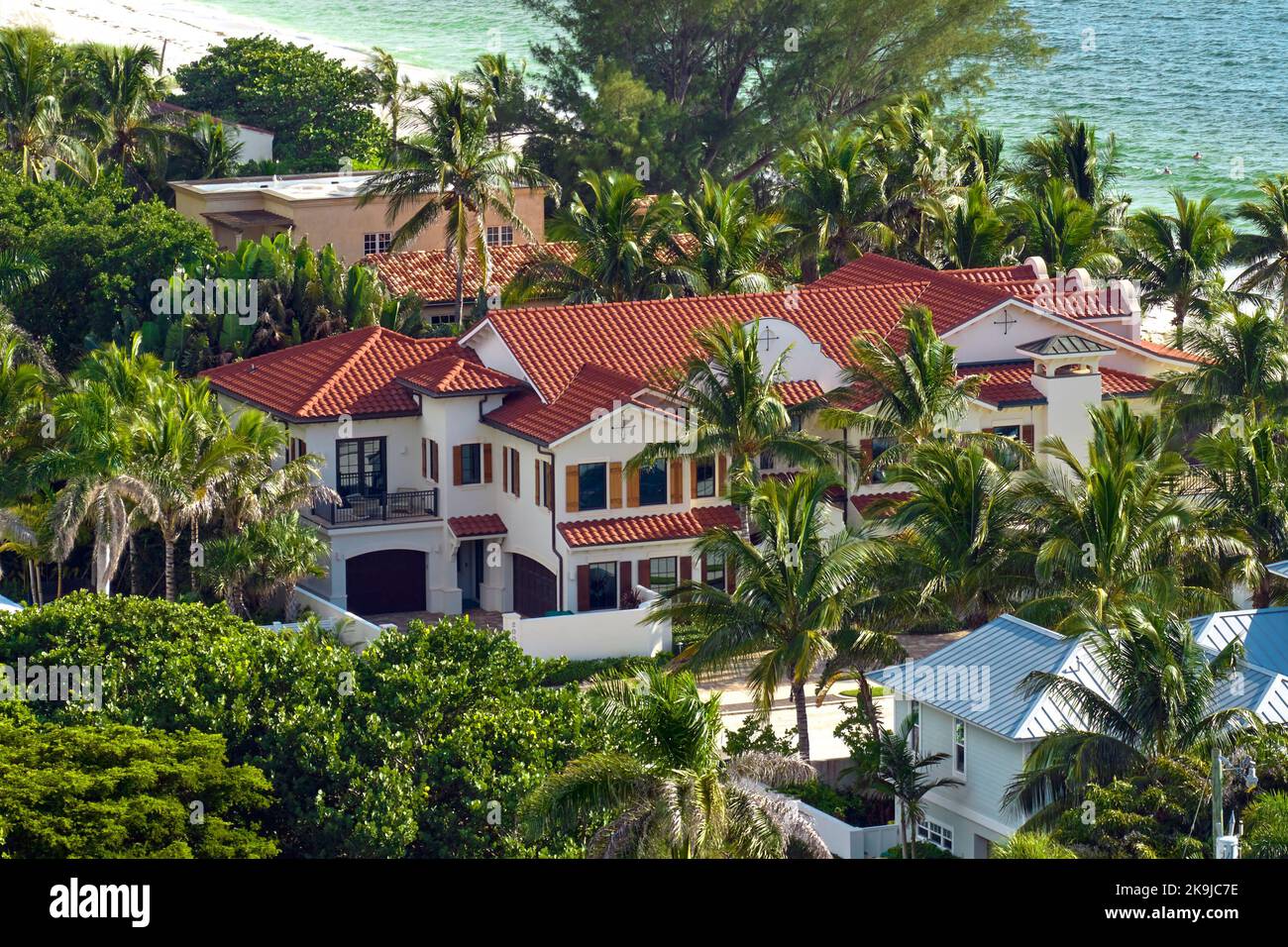 View from above of large residential houses in closed living golf club ...