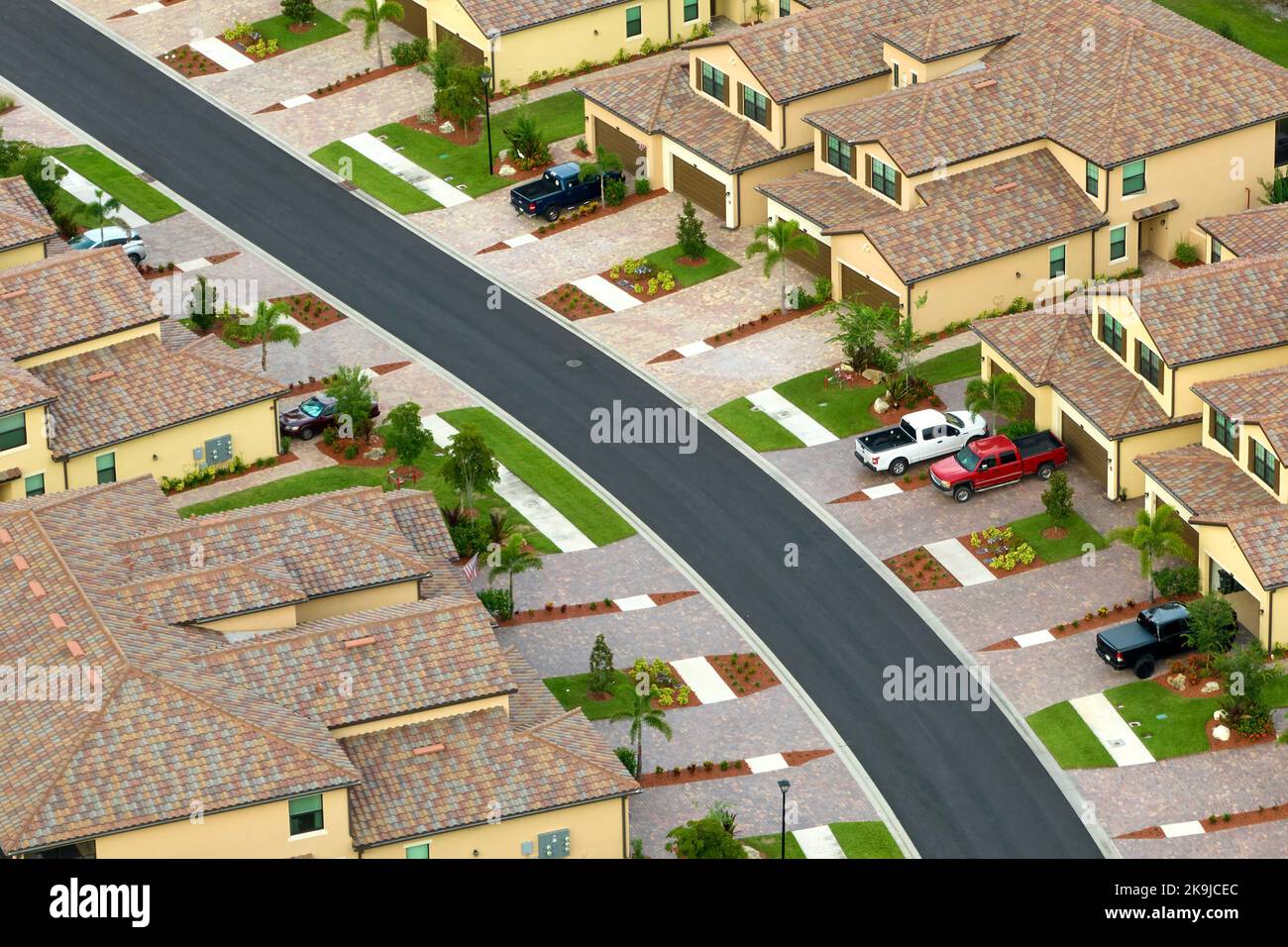 Aerial view of tightly located family houses in Florida closed suburban ...
