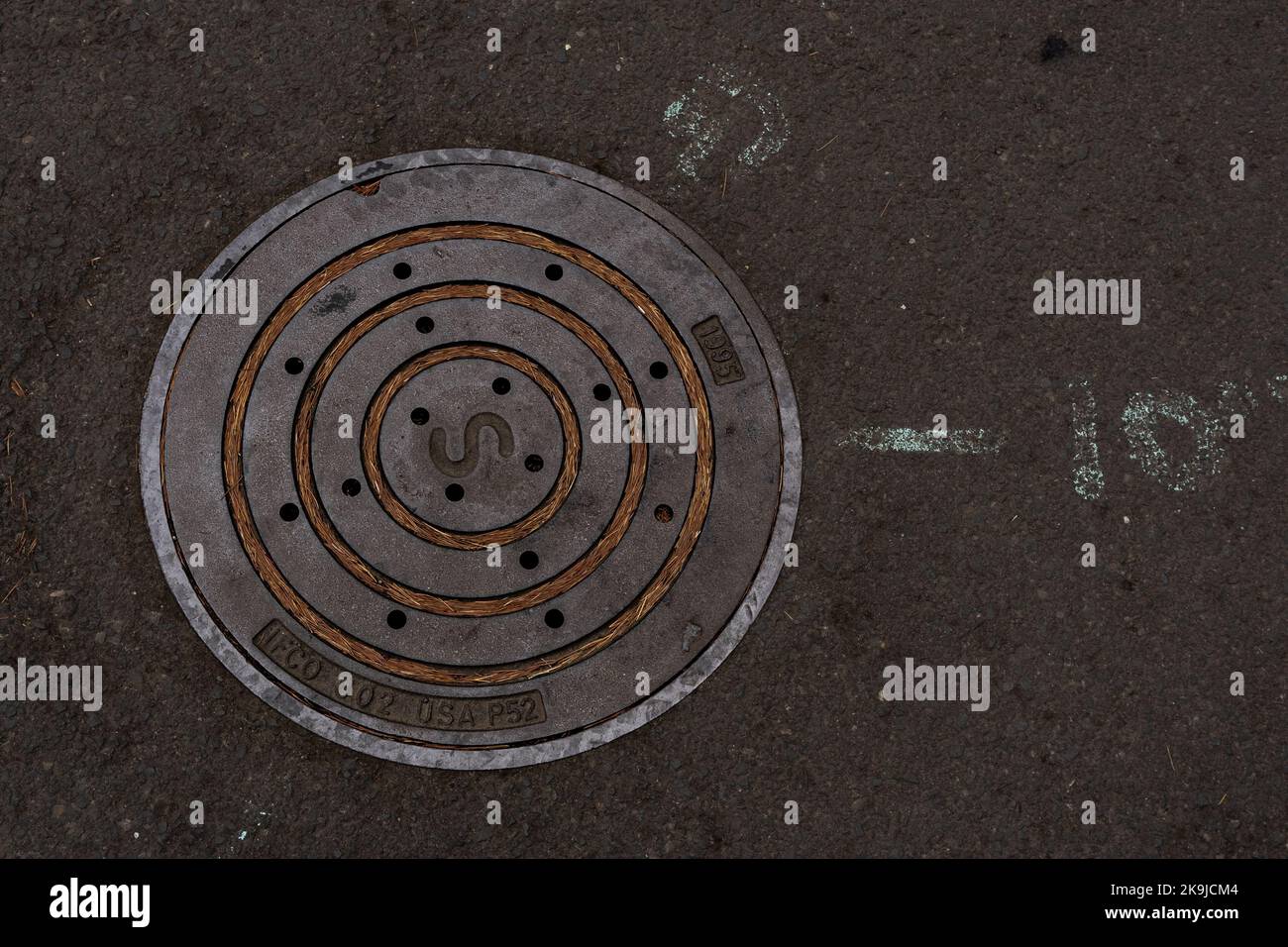 Manhole cover with painted numbers hi-res stock photography and images ...