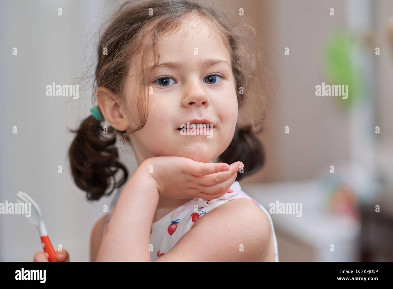 cute girl talking while eating Stock Photo - Alamy