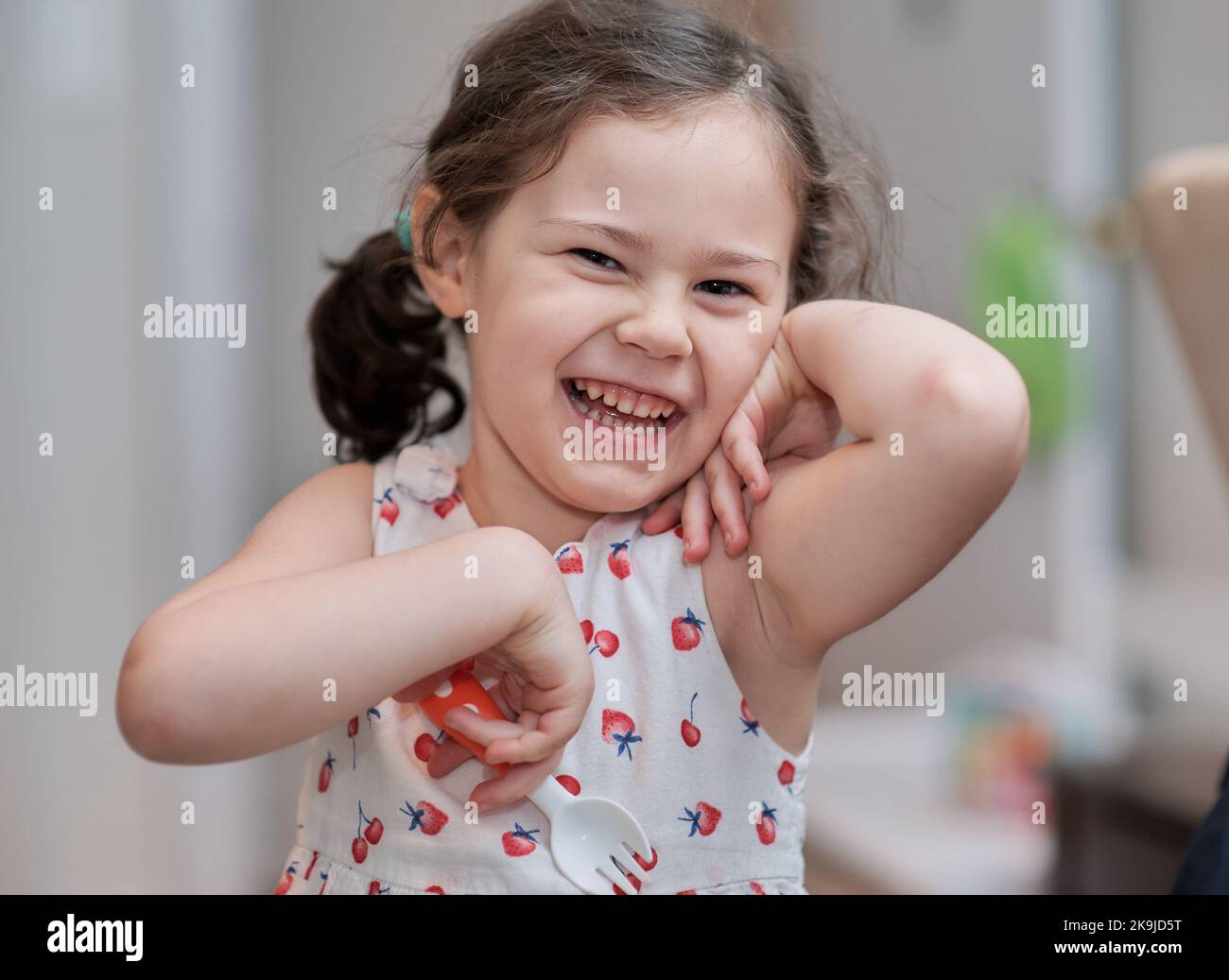 cute girl talking while eating Stock Photo - Alamy