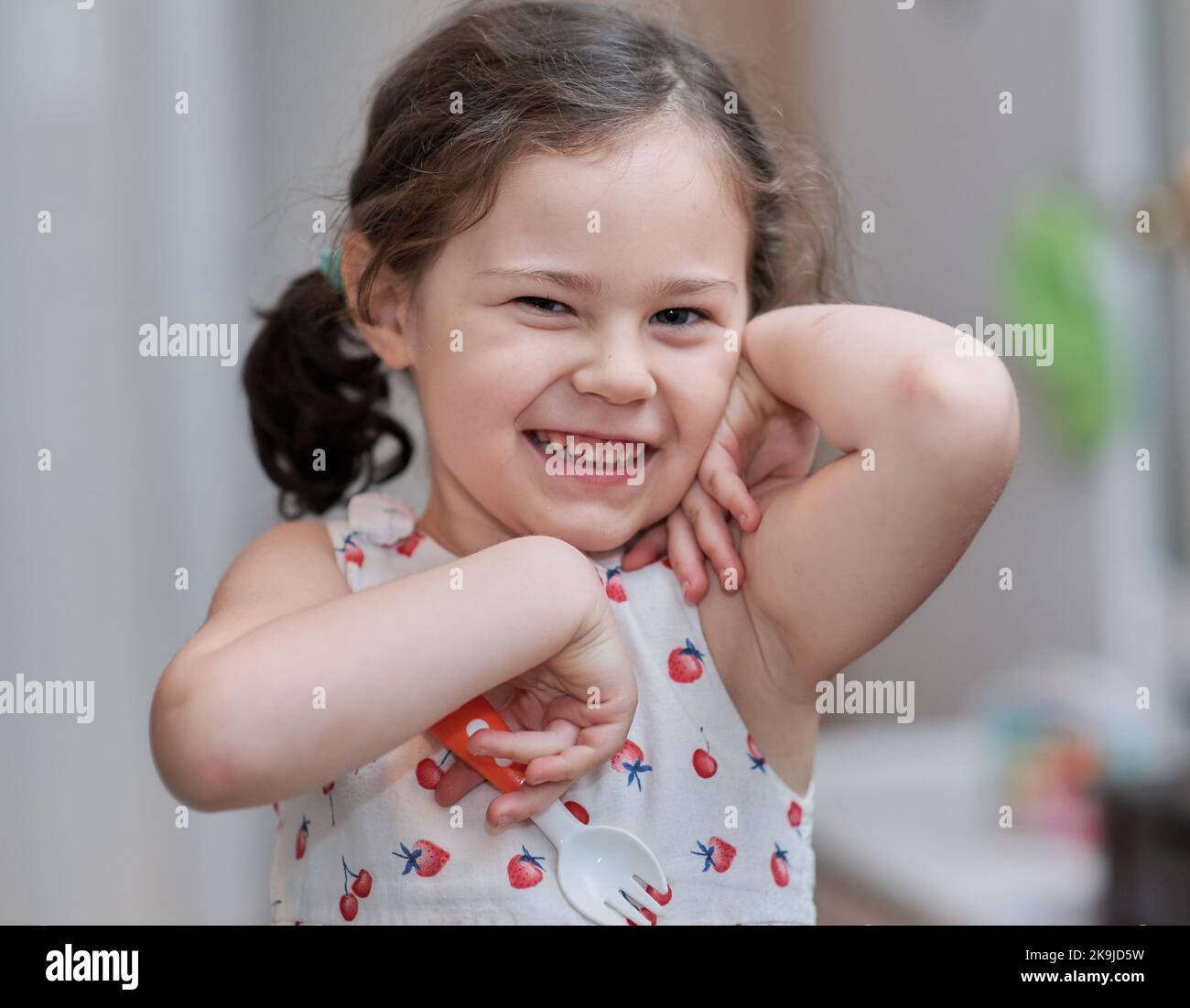 cute girl talking while eating Stock Photo - Alamy