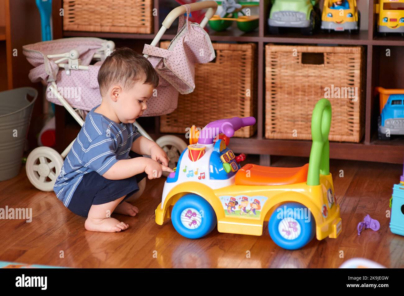 little boy playing with his toys and toy computer Stock Photo - Alamy