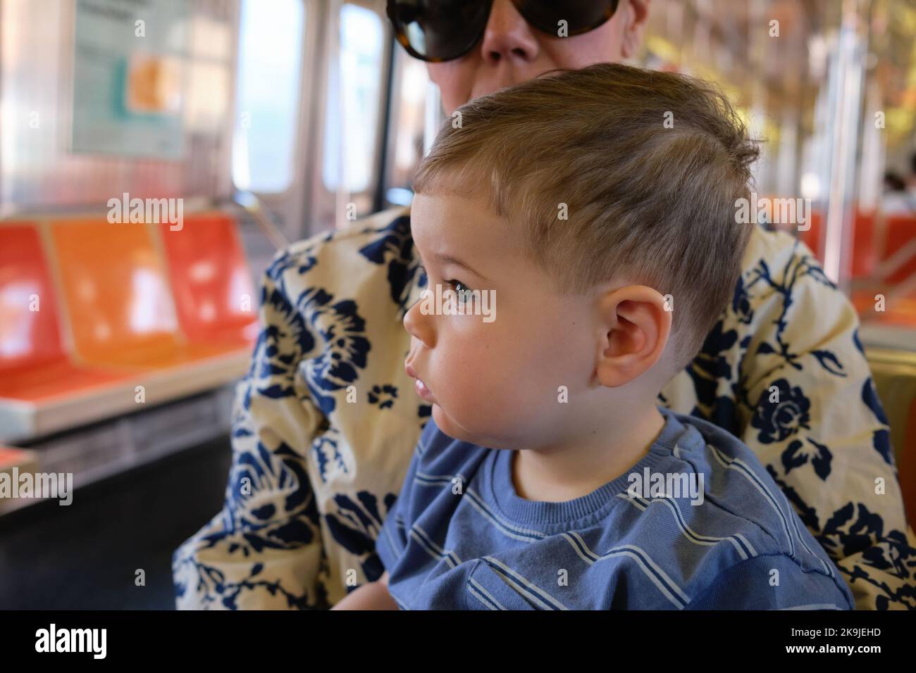 Baby on train seat hi-res stock photography and images - Alamy