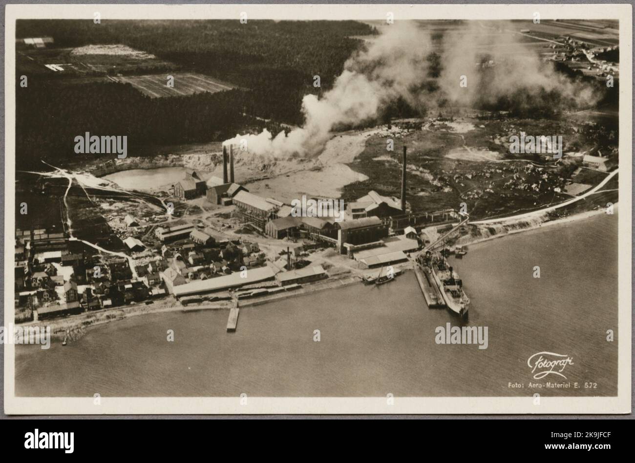 Aerial photo over unknown place with harbor Stock Photo - Alamy