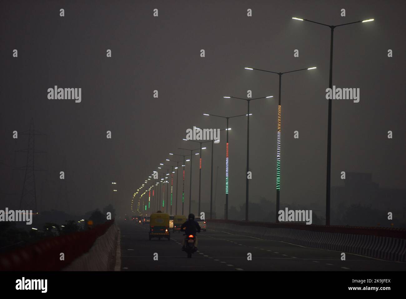 NOIDA, INDIA - OCTOBER 28: Commuters out on a hazy morning on October ...