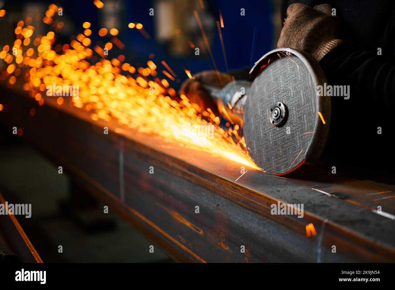 Cutting of metal beam with abrasive tool at metalwork plant Stock Photo ...