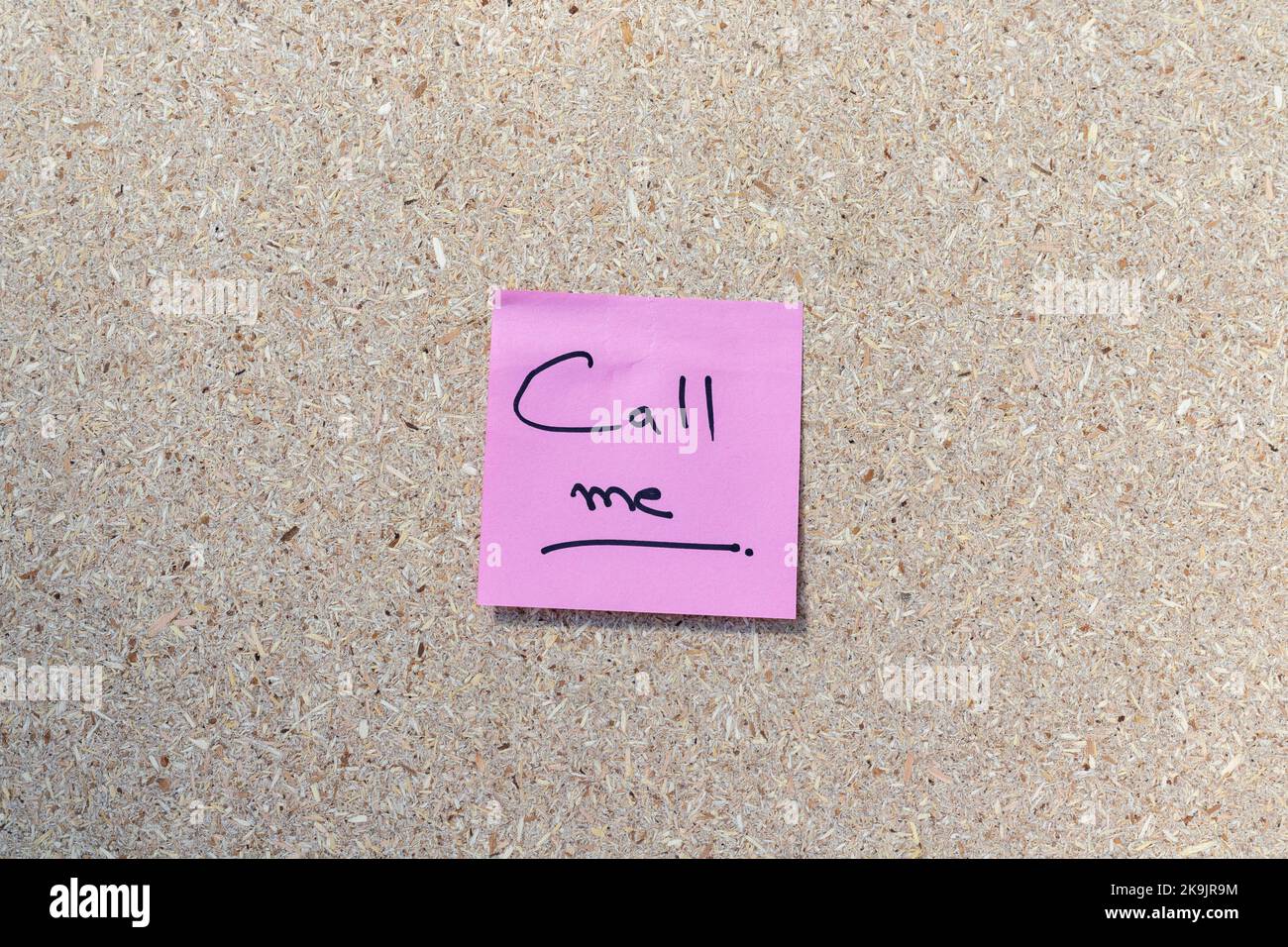 Reminder note of Call me on a sticky note on notice board Stock Photo ...