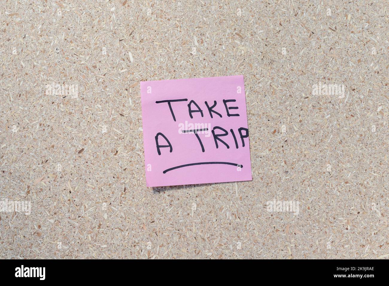 Take a trip hand written note Stock Photo - Alamy
