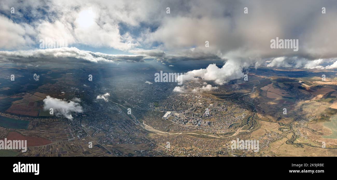 Aerial view from airplane window at high altitude of distant city ...