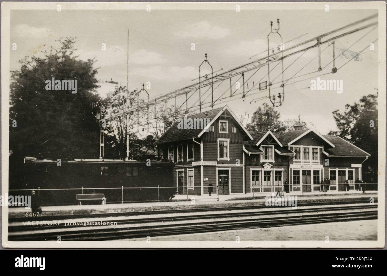 Track side of station with view at station house and electrified yard ...