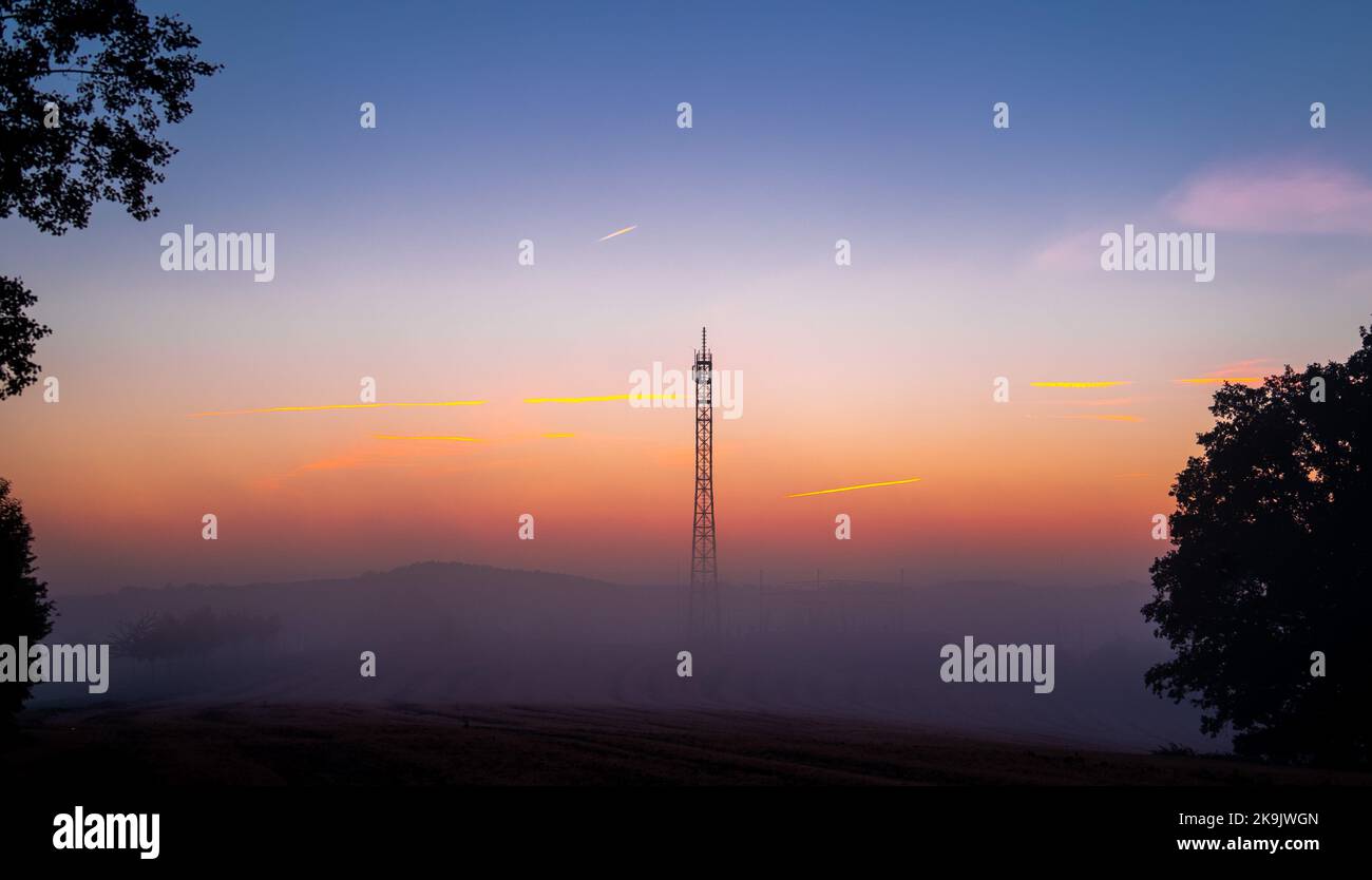 relay Cell tower in the early morning against the background of an ...