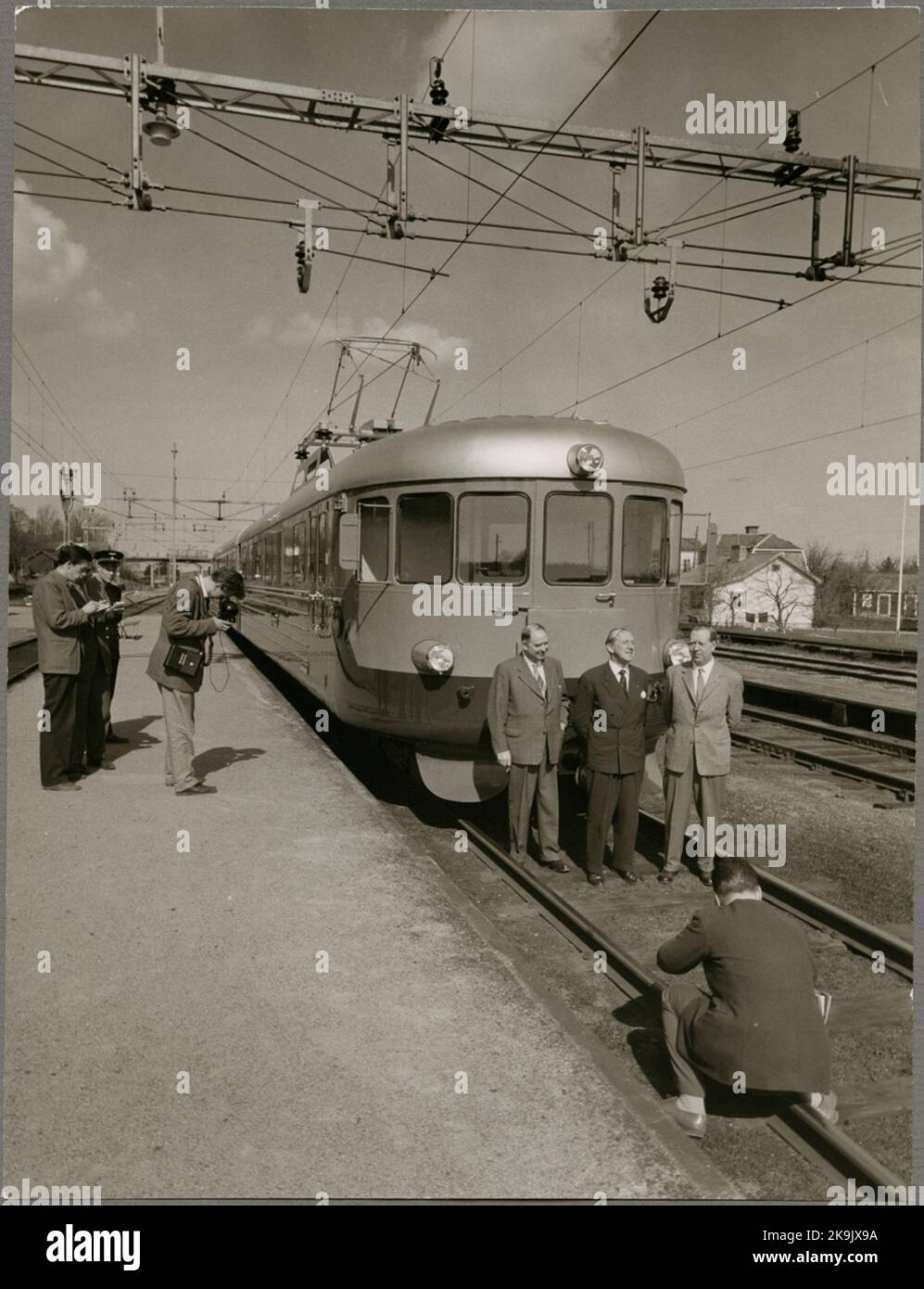 Group photo in front of rail buses at platform Stock Photo - Alamy
