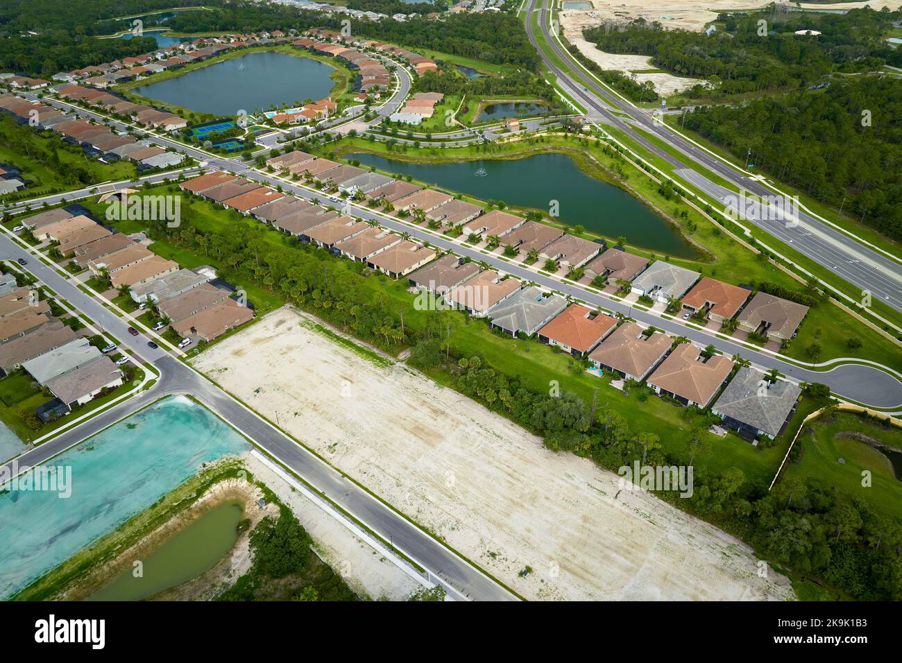 Aerial view of real estate development with tightly located family ...