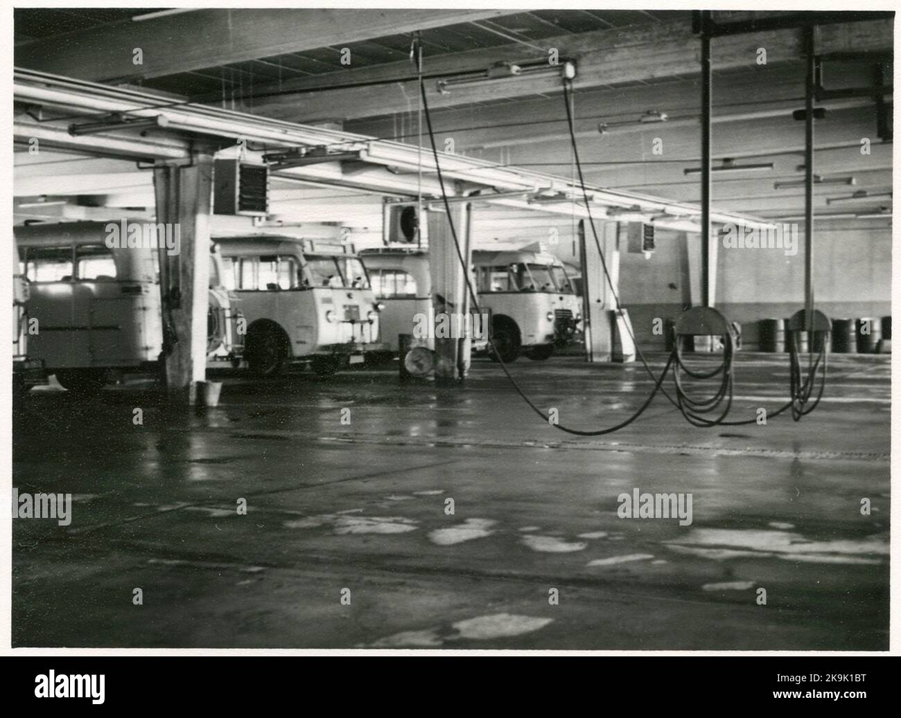 Buses in garage Stock Photo - Alamy