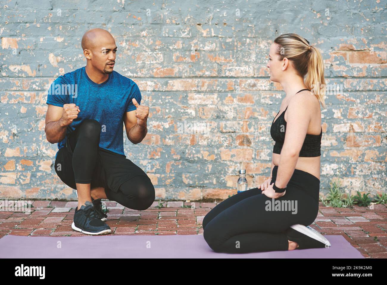 I want you to use your strength. a young woman working out with her ...