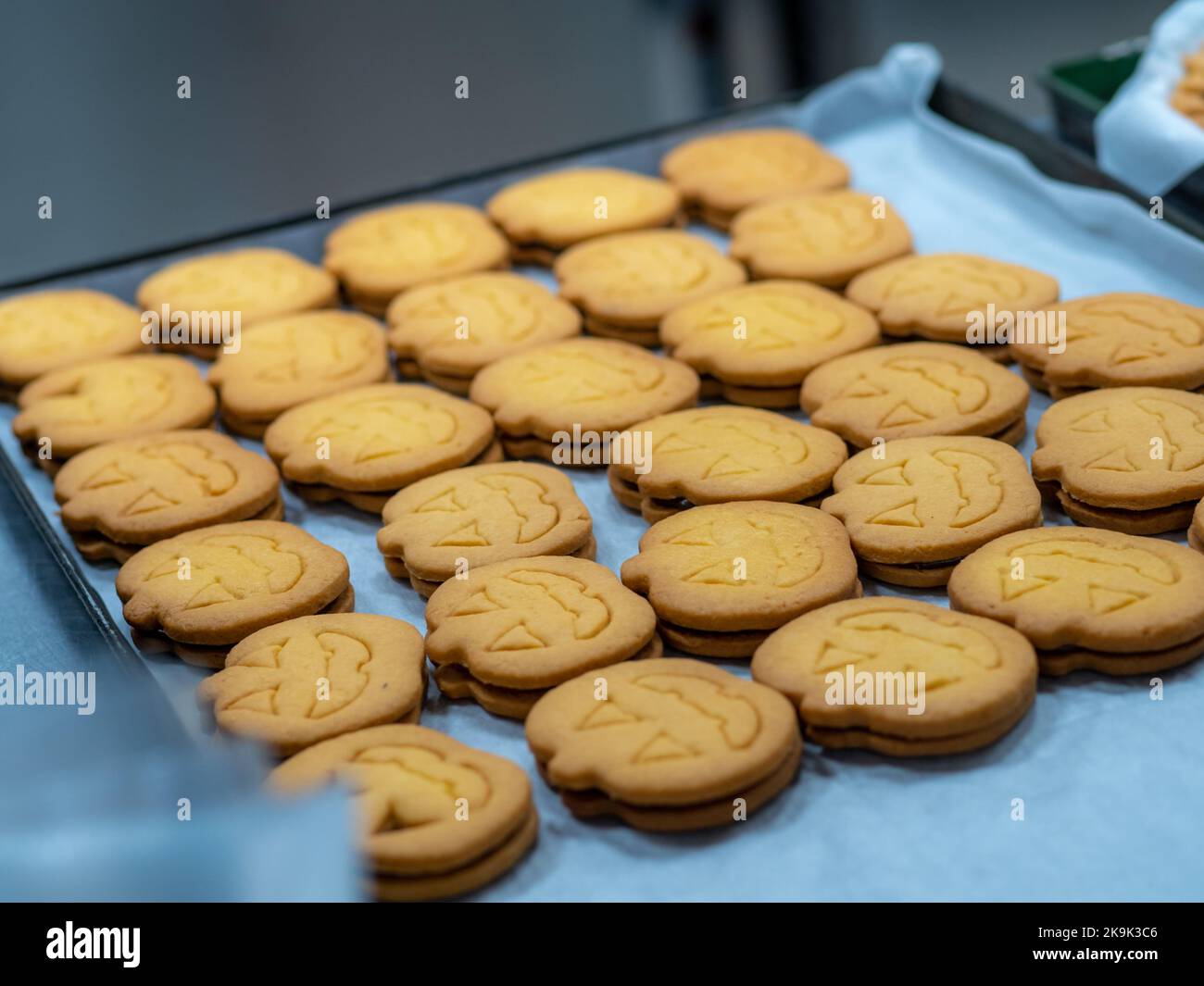 preparing sweet yellow cookies in the bakery Stock Photo - Alamy