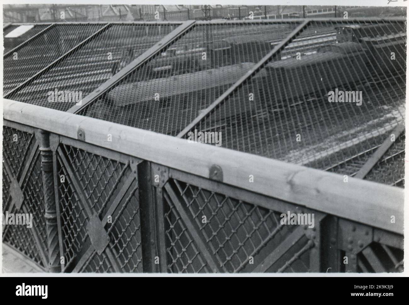 Safety rails on pedestrian bridge over yard Stock Photo - Alamy