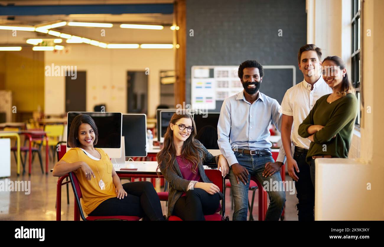 Getting things done with great minds. a group of colleagues standing ...