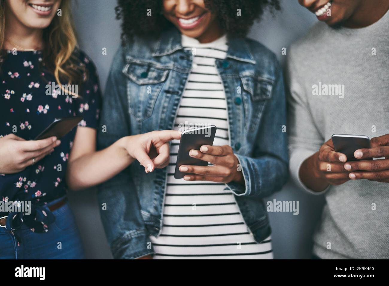 Could you send that to me. Studio shot of three unrecognizable young ...