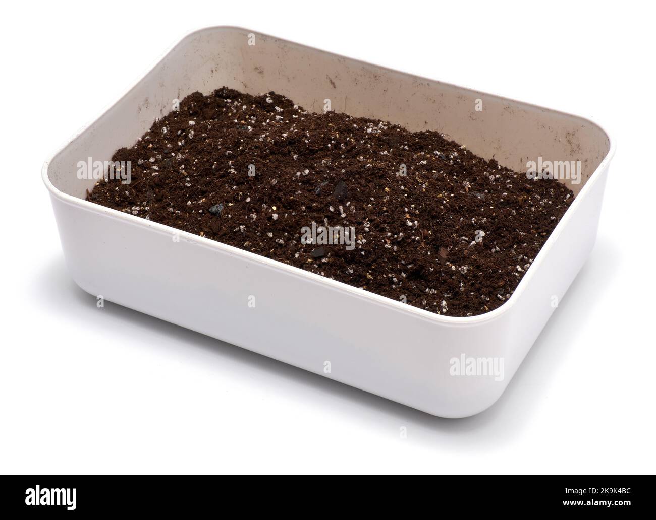 plastic box with substrate soil for transplanting houseplants isolated ...