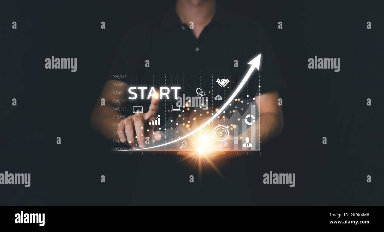 Startup success business concept. Businessman touching start text with ...