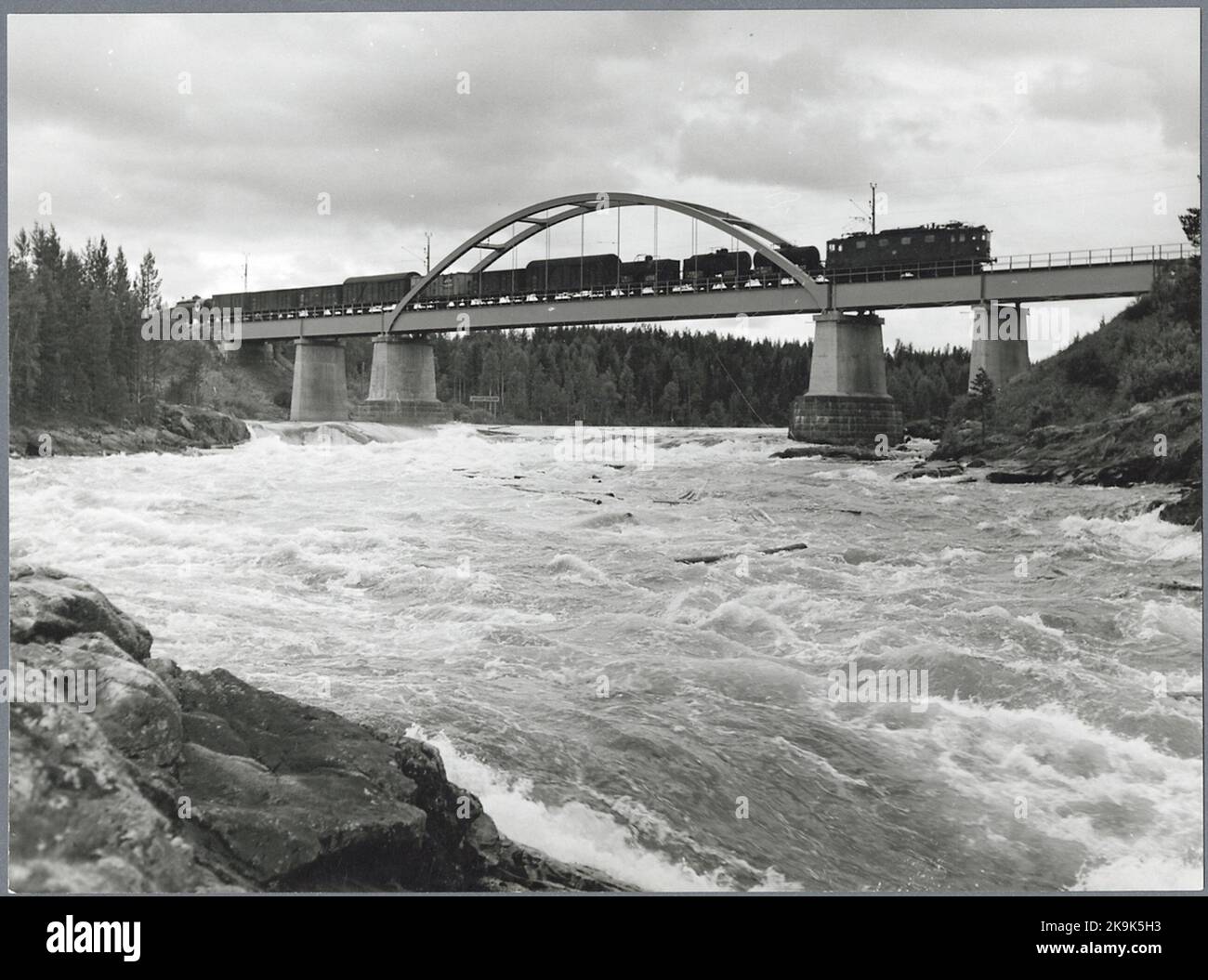 Freight train on the bridge over the Skellefte River on the line ...