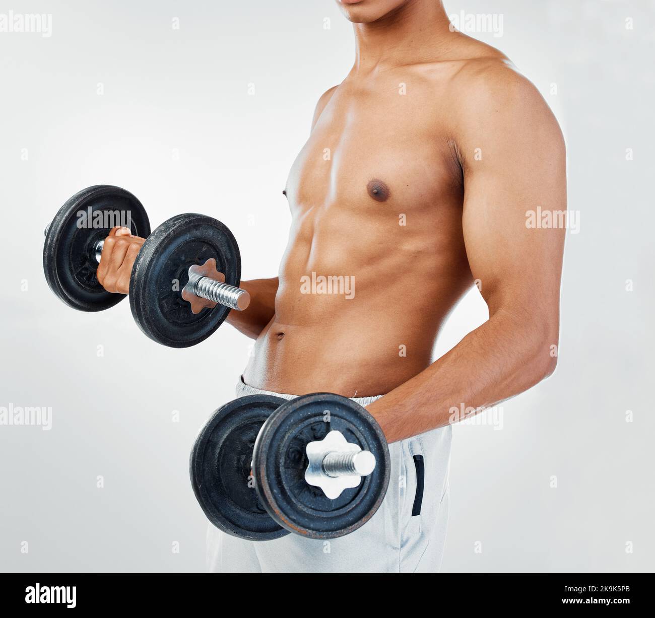 Man dumbbell exercise, workout fitness and strong athlete in white ...