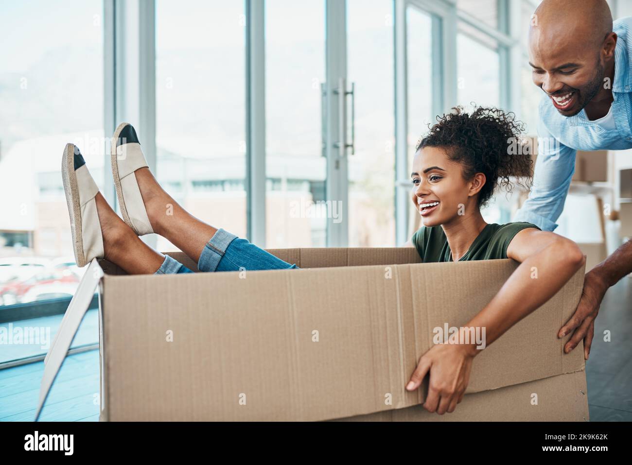 Let our life of fun and joy begin. a young couple having fun while ...