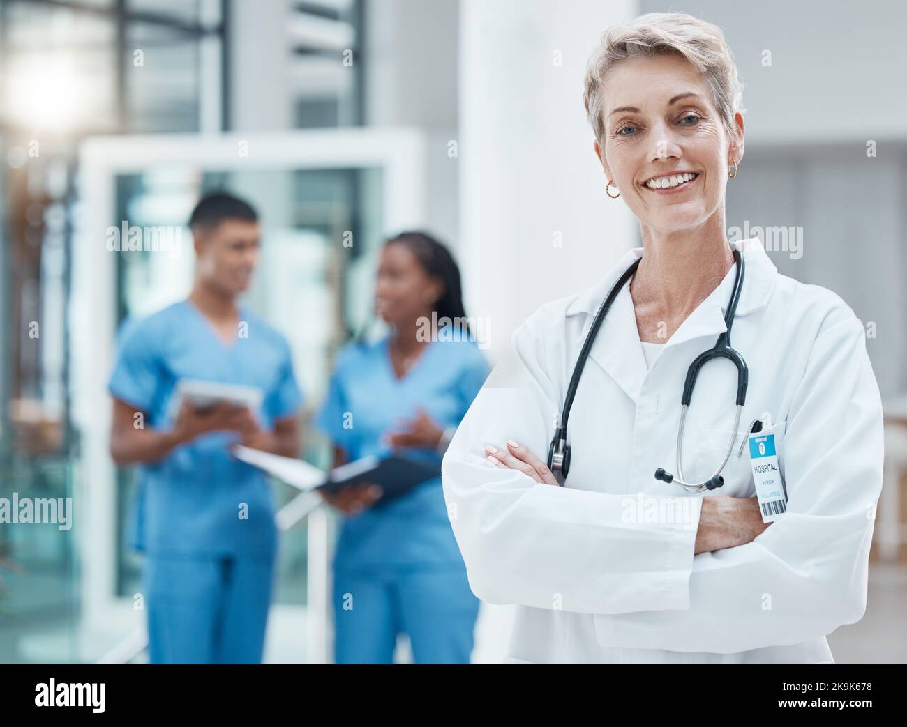 Woman, doctor and smile of a proud medical worker with nurse group ...
