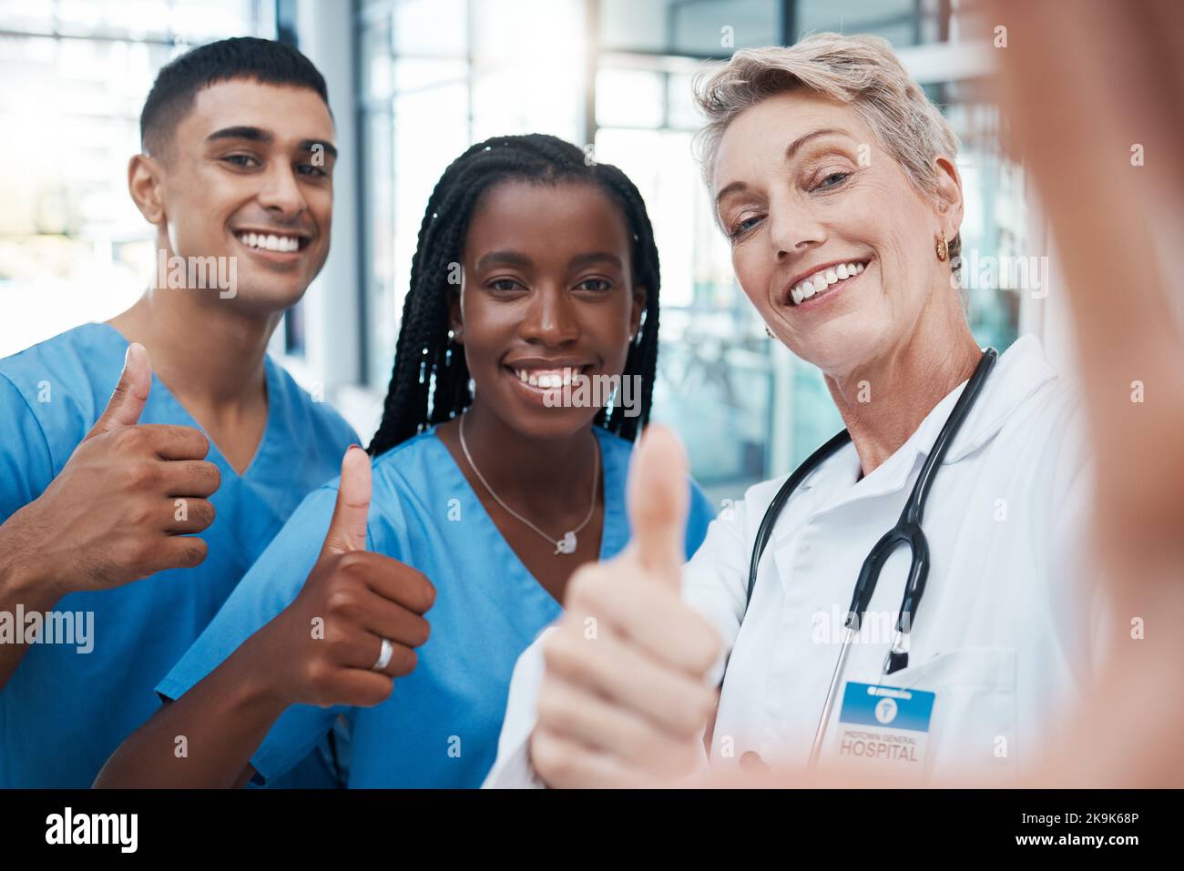 Selfie, doctor and students with thumbs up portrait at hospital for success, diversity and ...