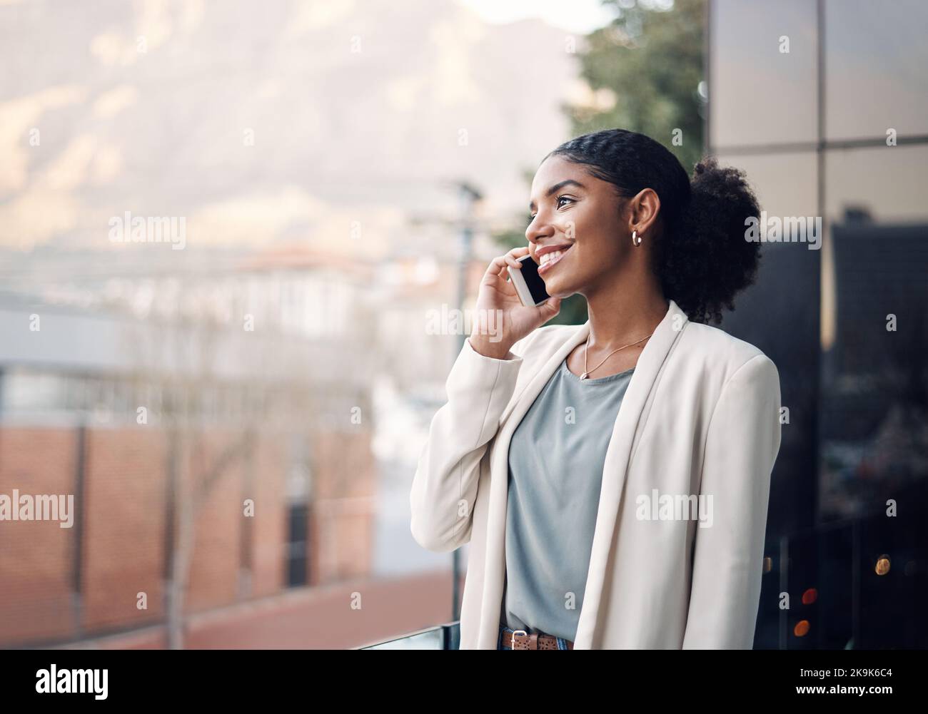 Success called, she answered. a young businesswoman using a mobile ...