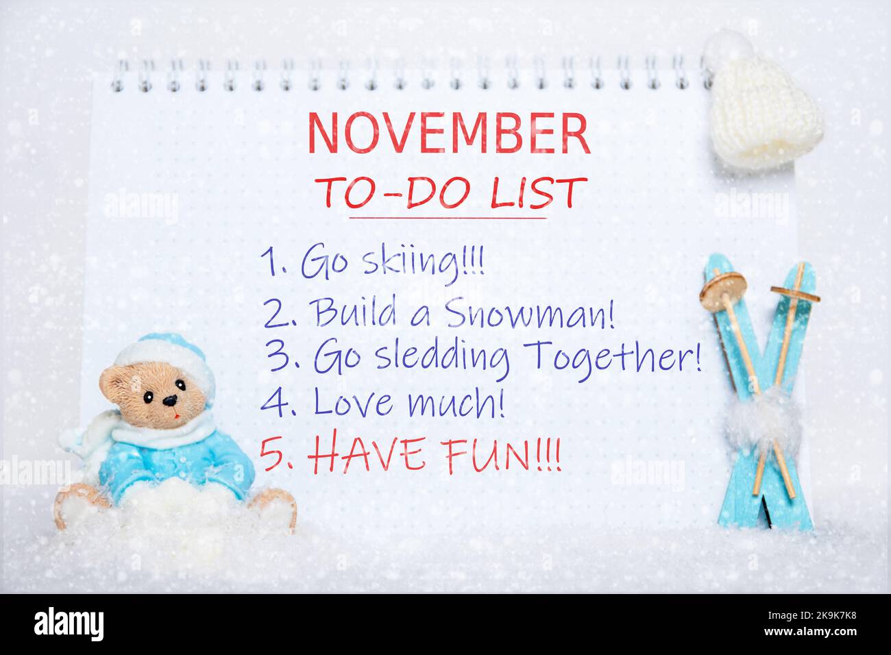 November to-do list. Notepad with to-do list: skiing, making a snowman ...