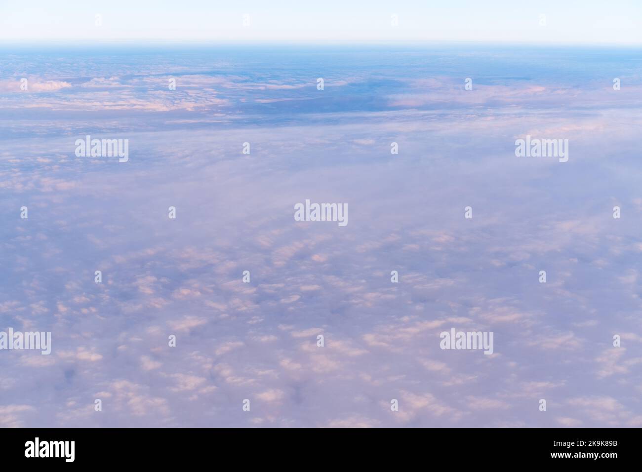 Background of a pink heavenly sky with fluffy dense clouds, top view ...