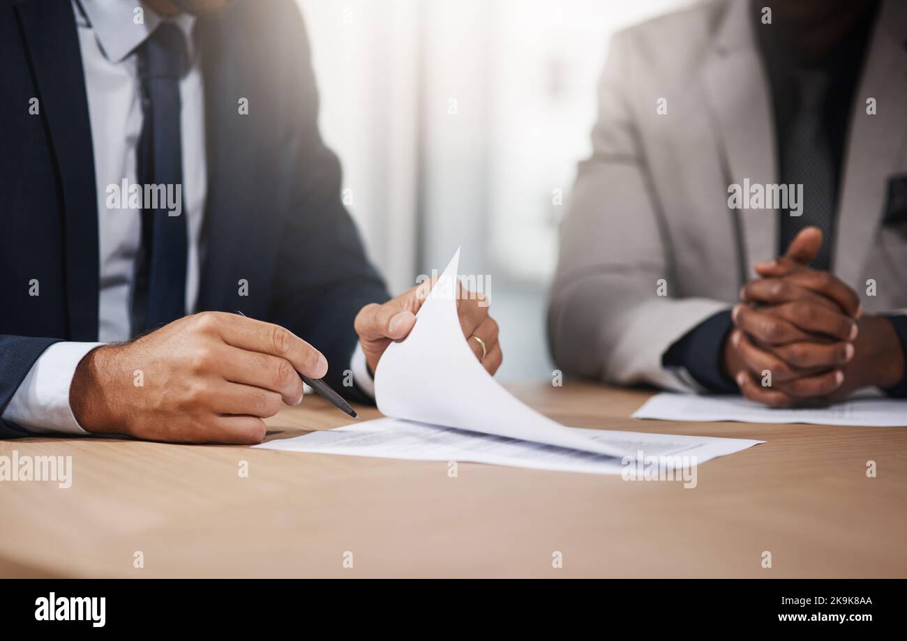 Validating all the forms. Closeup shot of two unrecognizable ...