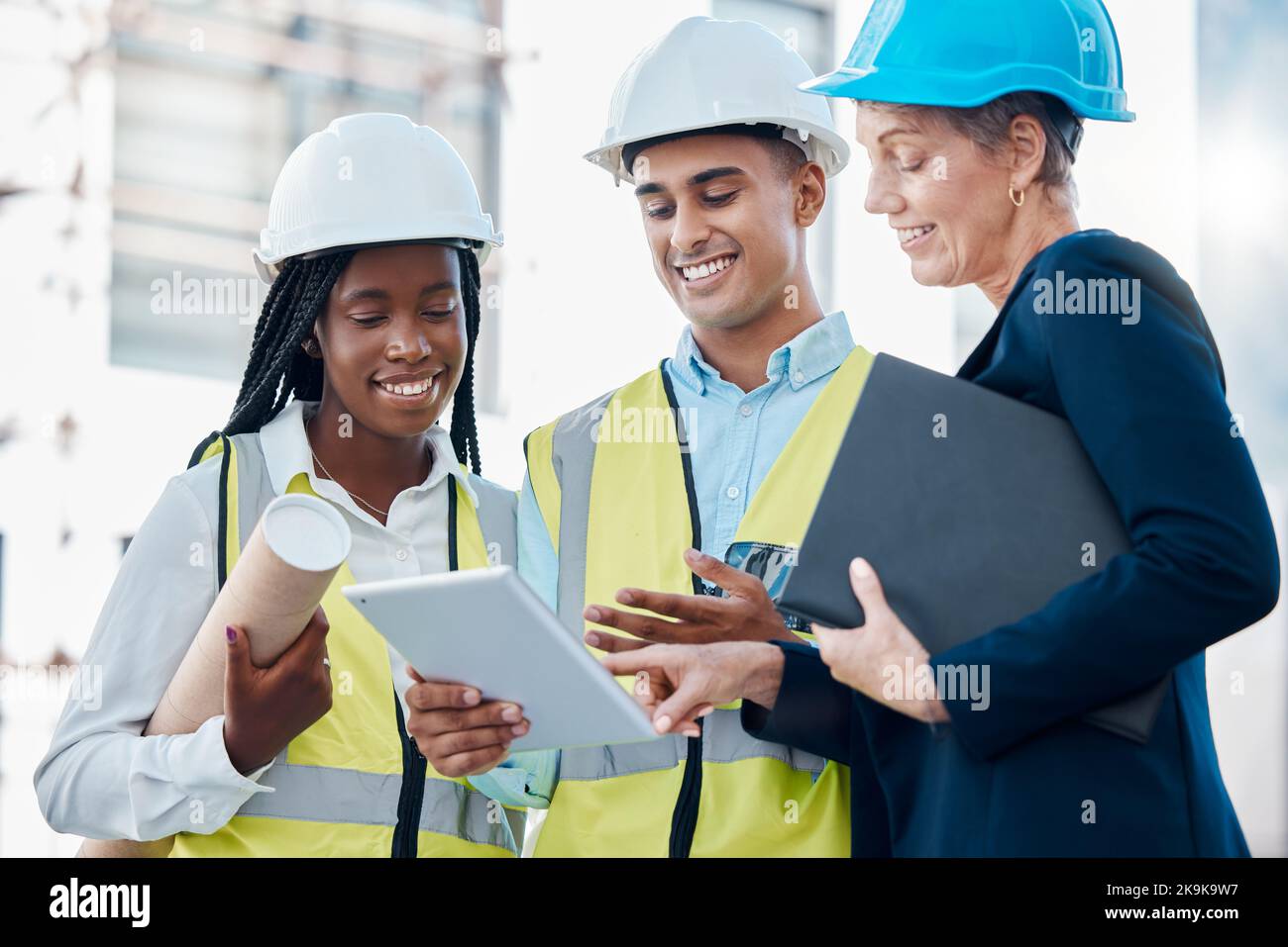 Architecture, construction and architects planning with a tablet for ...