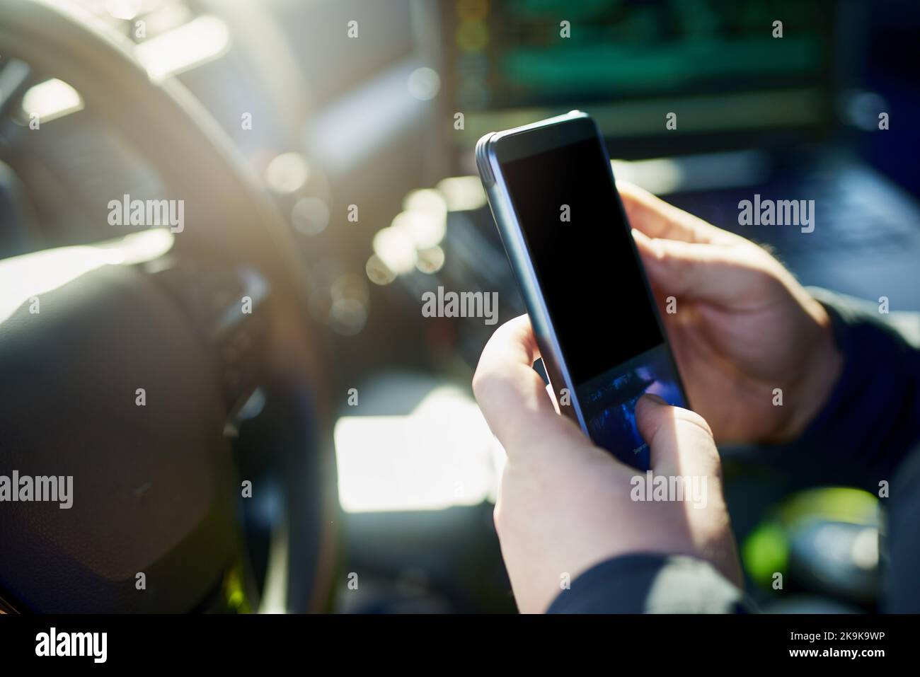 Checking is text alerts. an unrecognizable male police officer using ...